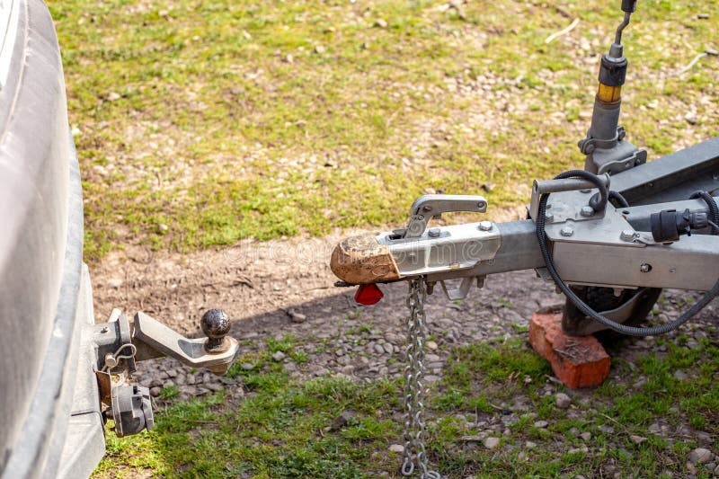 A Passenger Car Next To a Trailer Hitch. Towing Hitch Stock Image ...