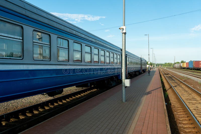A Passenger Electric Train is Standing on the Platform at the Stop ...
