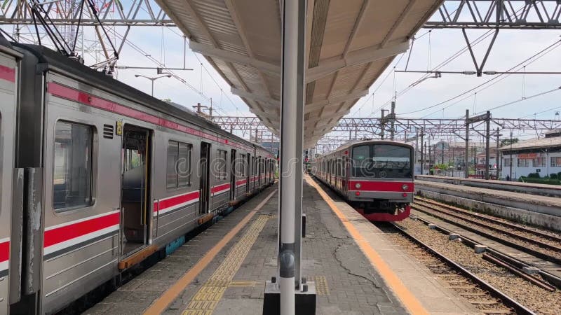 Passenger Lanes between Arriving and Departing Trains Stock Footage ...