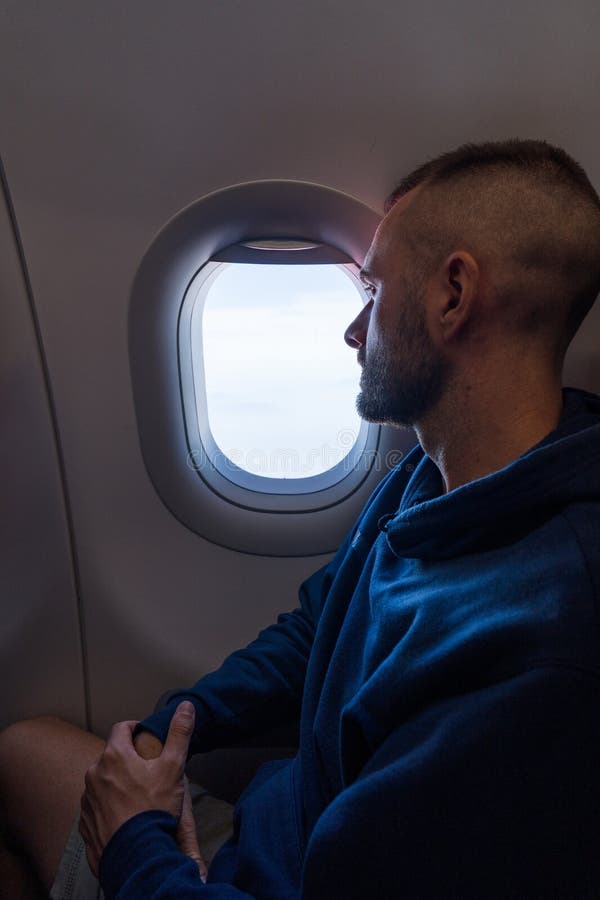 106 Man Looking Out Window Airplane Flying Stock Photos - Free ...