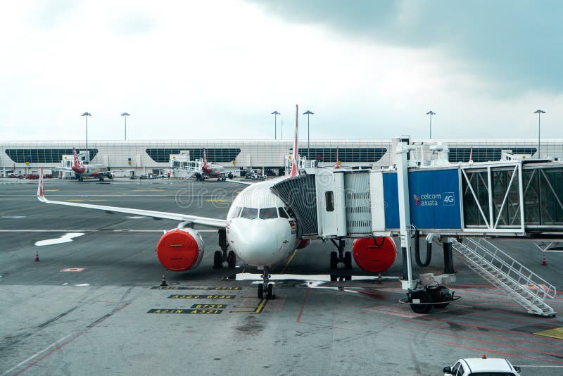 Passenger Plane Boarding Passengers by Jet Bridge Editorial Stock Image ...