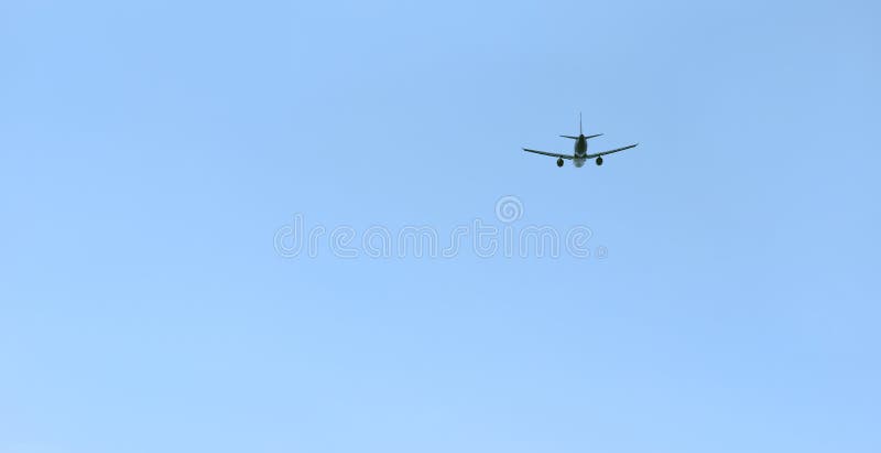 The Passenger Plane Flies Away into the Blue Sky. Back View Stock Image ...