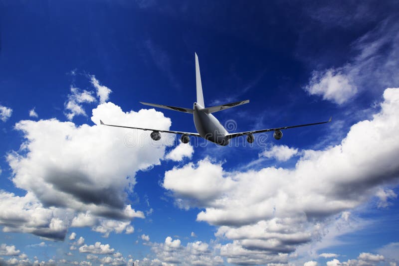 Passenger Plane in Flight. Aircraft Fly High in the Blue Sky Over the ...