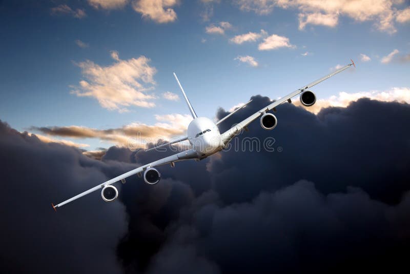 Passenger Plane with Left Heeling Flies through the Dark Clouds. Front ...