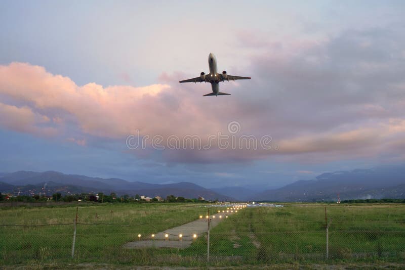 A Passenger Plane Flying Up Stock Photo - Image of field, green: 258426174