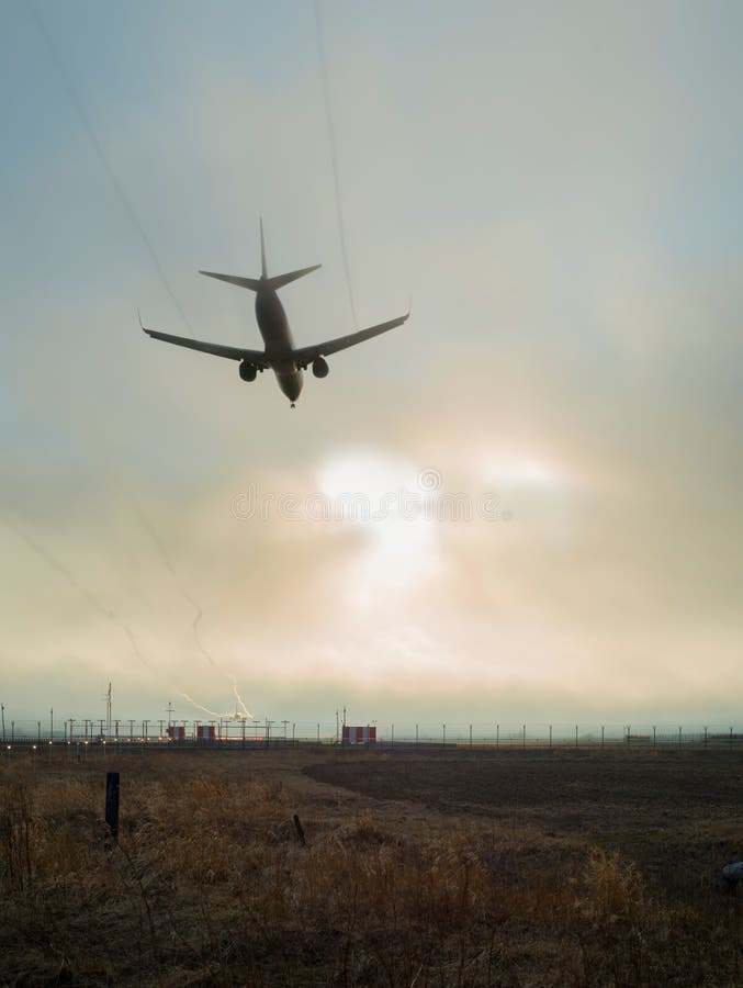 The Passenger Plane Landing at the Airport at Sunset Stock Image ...