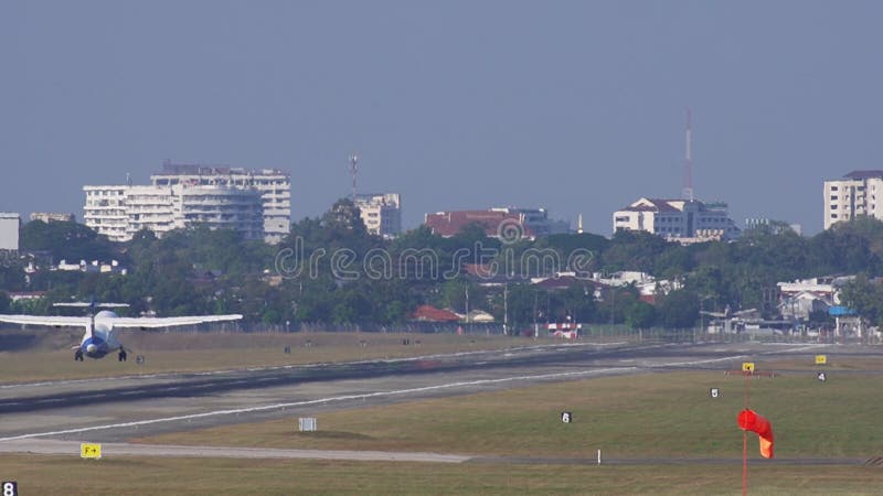 A Passenger Plane Landing on Runway. Back View on Landing Airplane ...