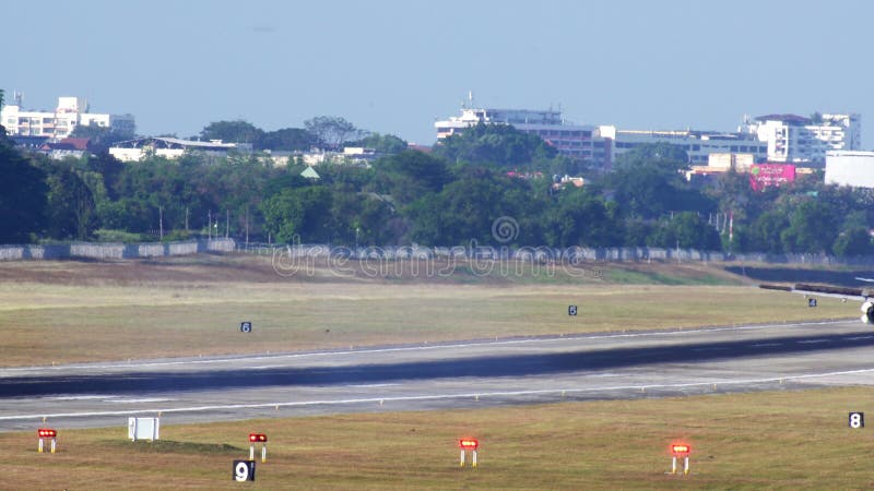 A Passenger Plane Landing on Runway. Back View on Landing Airplane ...