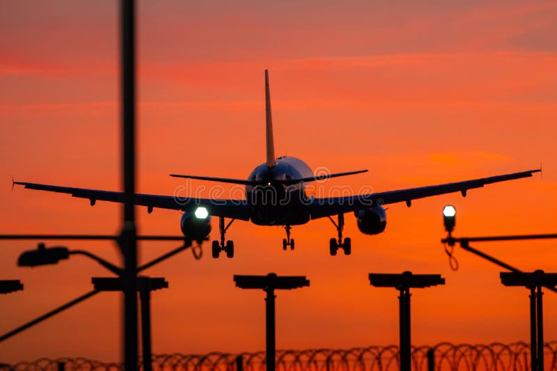 Passenger Plane Landing during Sunset Stock Photo - Image of beauty ...