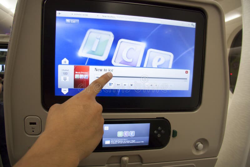 Passenger Pointing at the Touch Screen in a Plane Editorial Photo ...