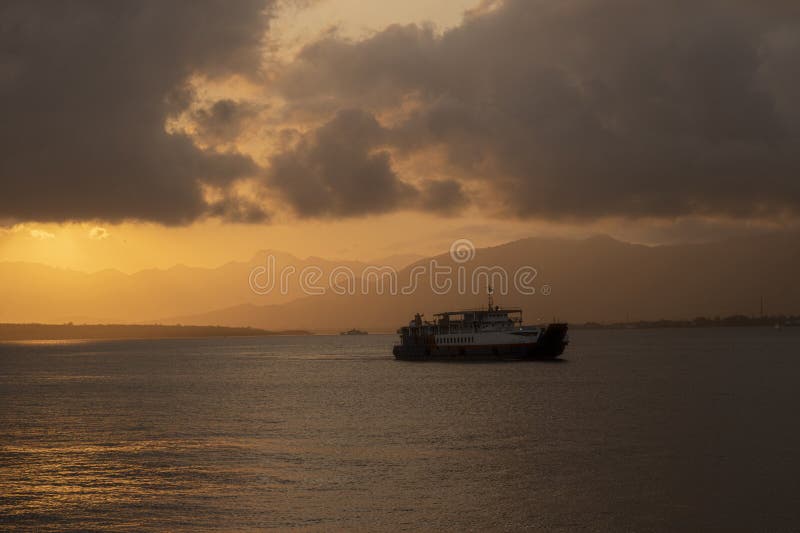 A Passenger Ship Sailing in the Bali Strait with the Background of the ...