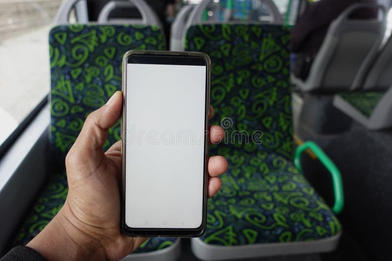 Passenger Sitting in a Bus Using His Phone. Stock Image - Image of ...