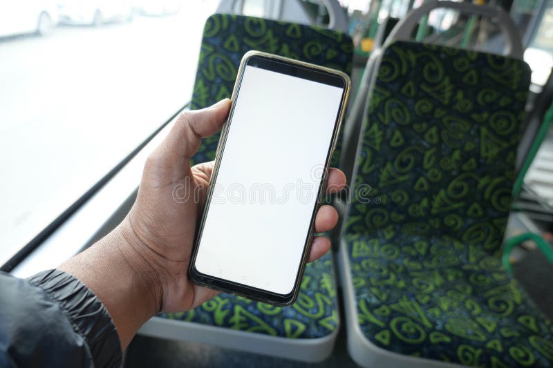 Passenger Sitting in a Bus Using His Phone. Stock Image - Image of ...