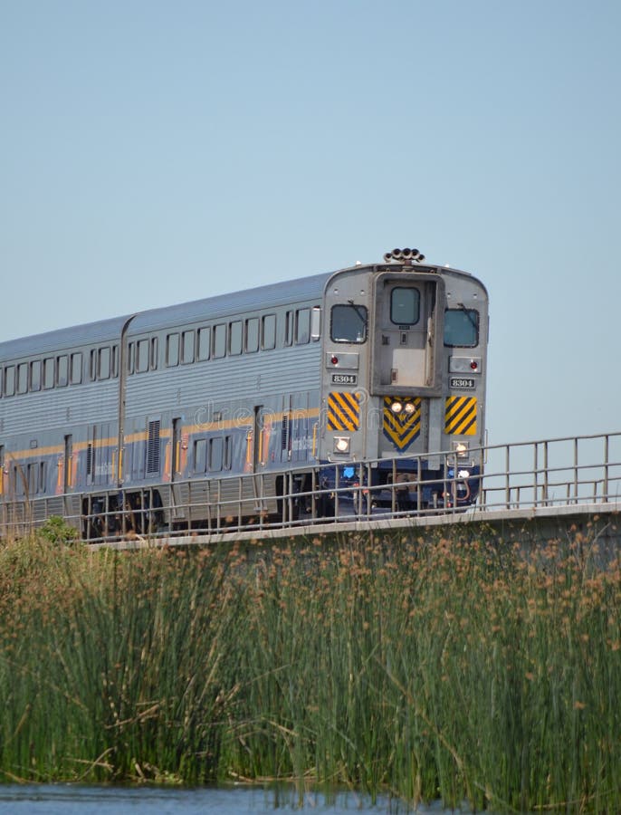A Passenger Train Approaching Down the Tracks Stock Photo - Image of ...