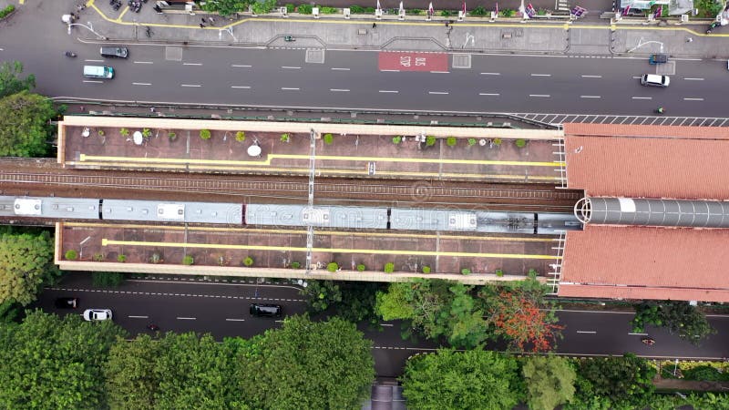 Passenger Train Arriving and Stopping at the Platform, Top Down Aerial ...