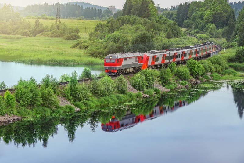 Passenger Train Moves Along the Lake Stock Image - Image of railroad ...