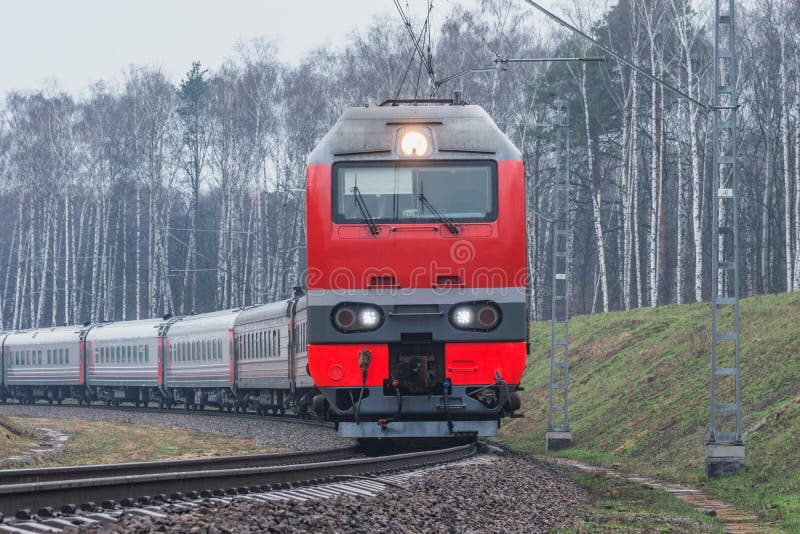 Passenger Train Moves at Spring Morning. Stock Photo - Image of wood ...
