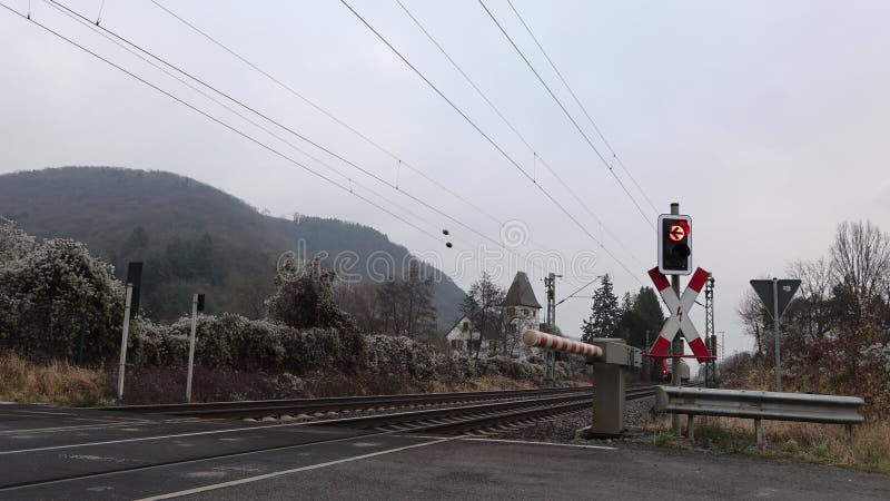 A Passenger Train Passes a Red Warning Sign Stock Footage - Video of ...