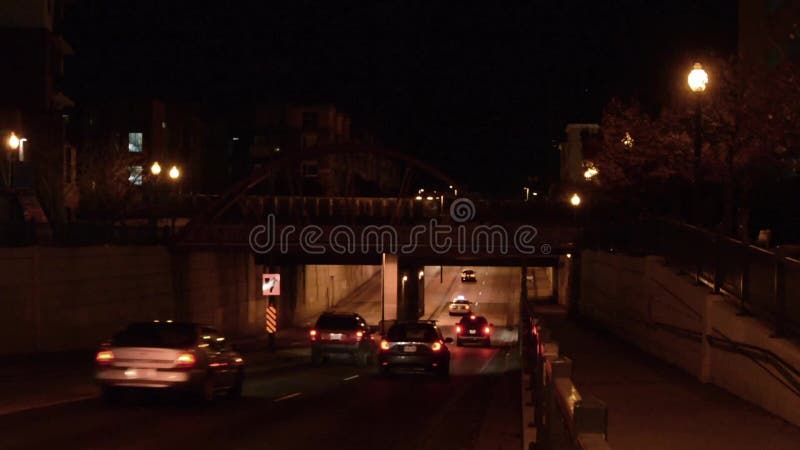 Passenger Train Passing Over Cars on an Underpass Stock Video - Video ...