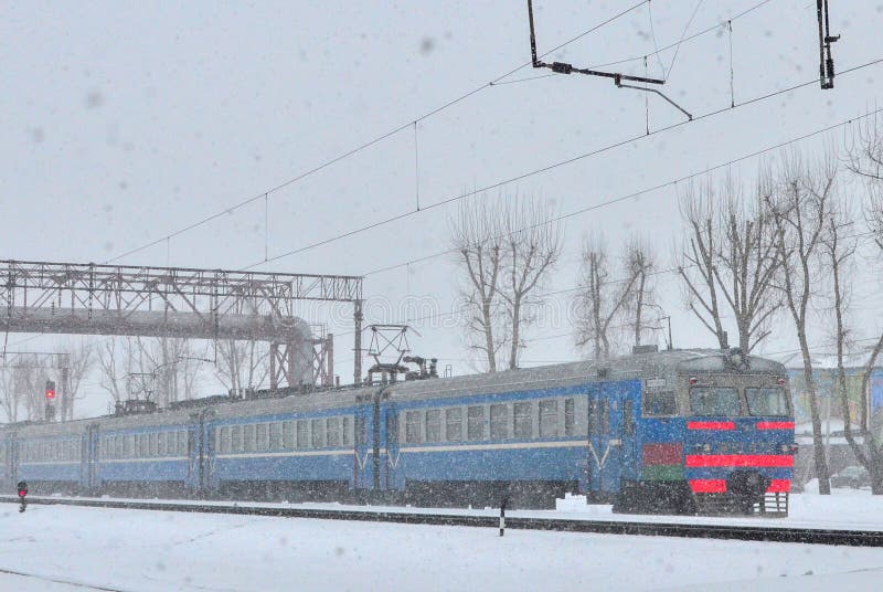 Passenger Train on the Railway Moves in a Large Snow Blizzard Stock ...