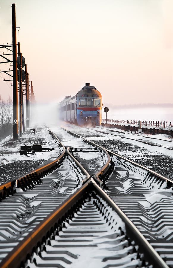 Passenger Train Rapidly Moving Along the Snow Stock Image - Image of ...
