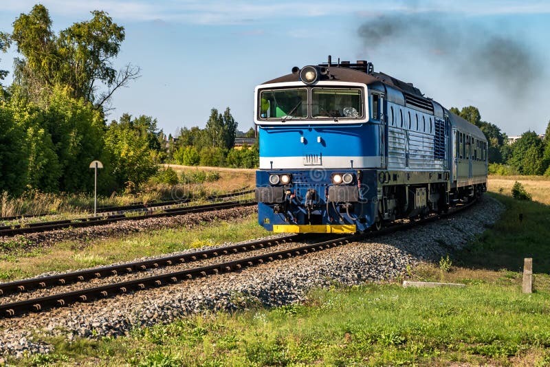 Passenger Train Rides among Fields on a Sunny Day Stock Photo - Image ...