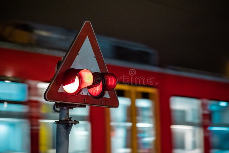 Passenger Train Rushing Past the Stop Signal Warning at Night. Night ...