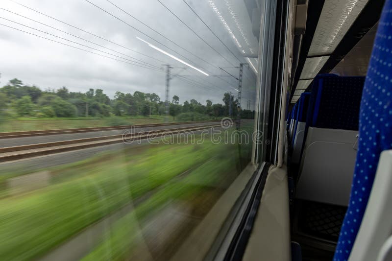 Passenger Train Window View during Daytime with Motion Blur Stock Photo ...