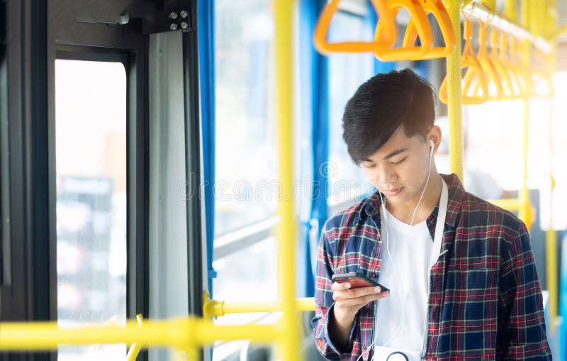 The Passenger Using Mobile Phone on the Public Bus. Stock Photo - Image ...