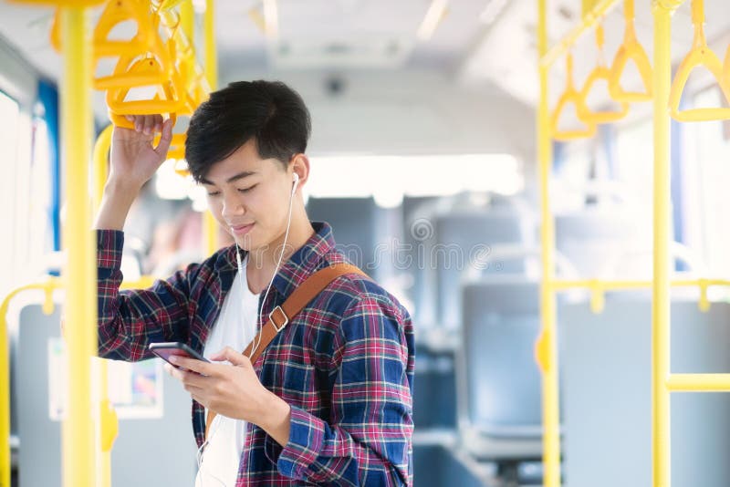The Passenger Using Mobile Phone on the Public Bus. Stock Image - Image ...