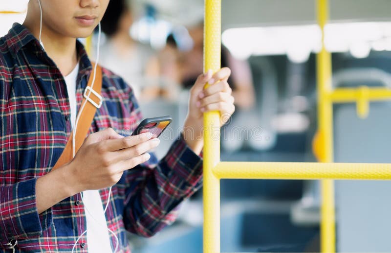The Passenger Using Mobile Phone on the Public Bus. Stock Image - Image ...