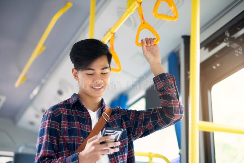 The Passenger Using Mobile Phone on the Public Bus. Stock Image - Image ...