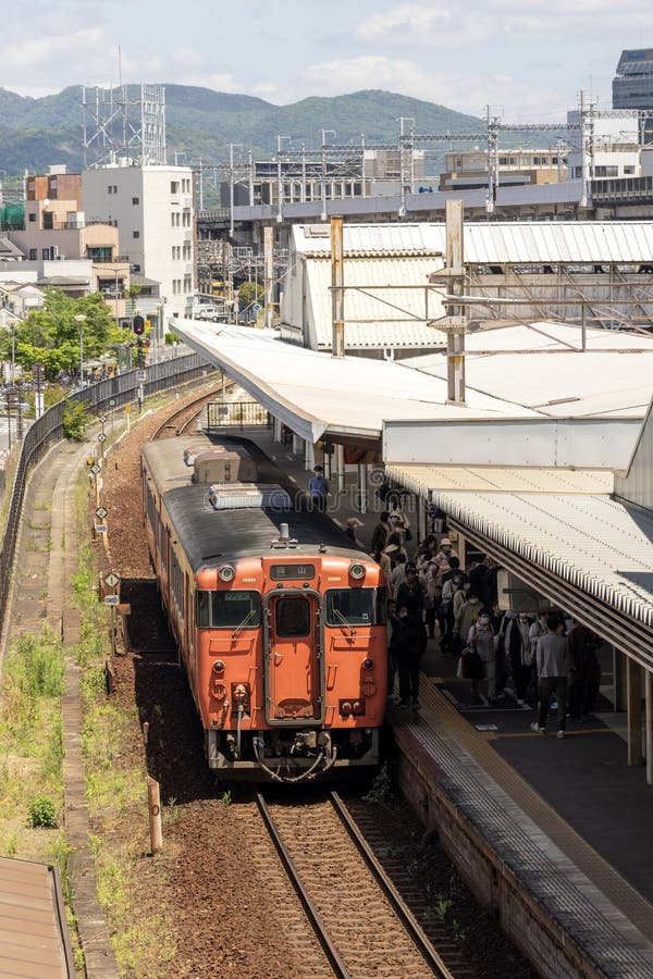Passengers Alight from a Local Train Arrived at Okayama Train Station ...