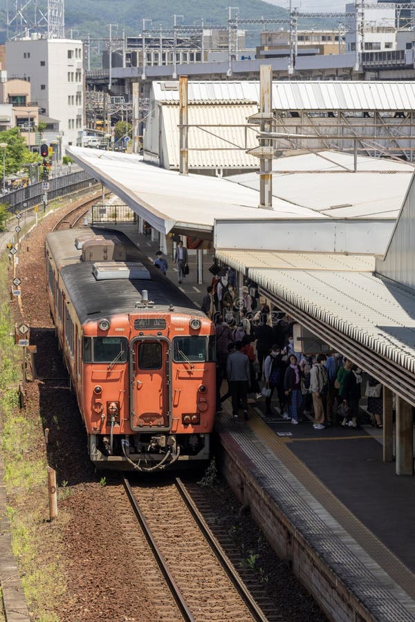 Passengers Alight from a Local Train Arrived at Okayama Train Station ...