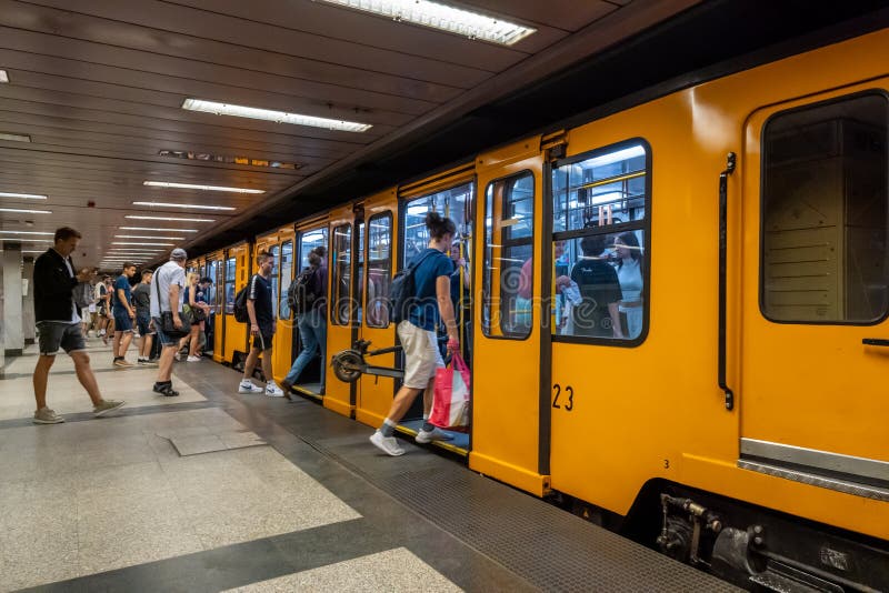 Passengers Boarding the Yellow Train Wagons of Budapest Subway ...
