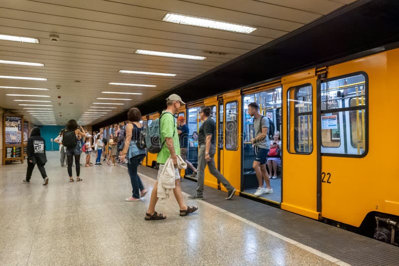 Passengers Boarding the Yellow Train Wagons of Budapest Subway ...