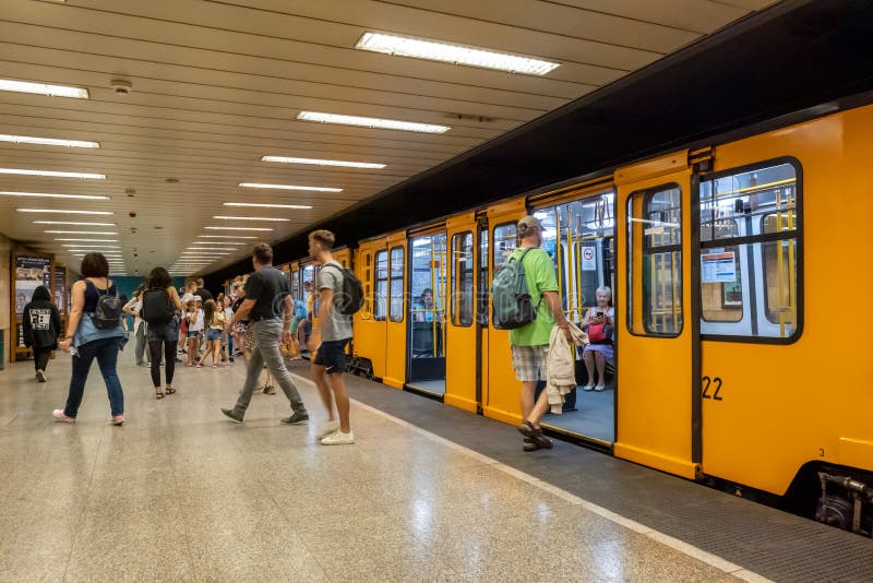 Passengers Boarding the Yellow Train Wagons of Budapest Subway ...