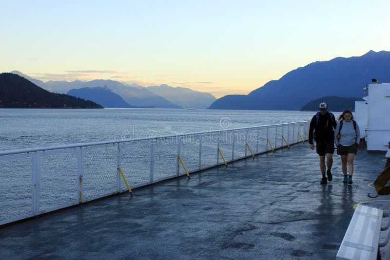 Passengers on the Deck of the BC Ferry Near Vancouver with Mountains ...