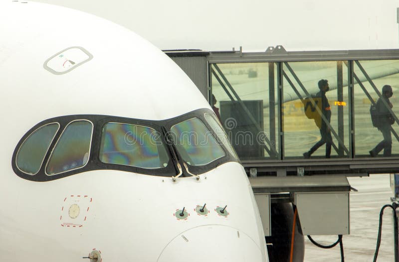 A Passengers Get Out of the Plane into the Tunnel Stock Photo - Image ...