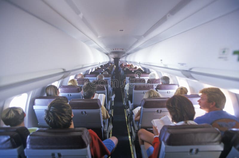 Airplane Passengers Watch TV on the Way from Los Angeles To Seoul South ...