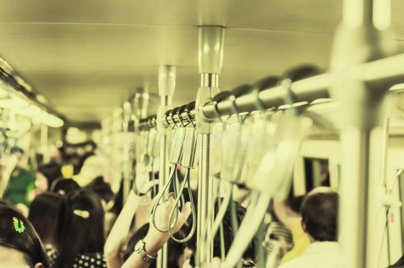 Passengers Standing on the Train during Rush Hours, and Using the ...