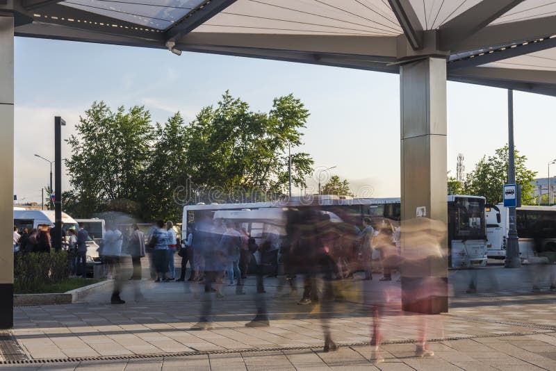 Passengers Waiting and Boarding Buses at the Bus Terminal Editorial ...