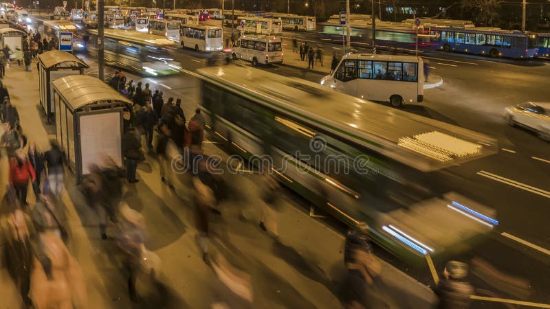 Passengers Waiting and Boarding Buses at the Bus Terminal Editorial ...