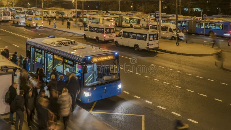 Passengers Waiting and Boarding Buses at the Bus Terminal Editorial ...