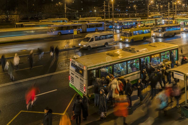 Passengers Waiting and Boarding Buses at the Bus Terminal Stock Image ...