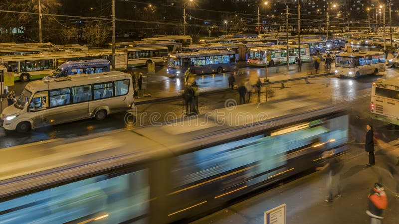 Passengers Waiting and Boarding Buses at the Bus Terminal Stock Photo ...