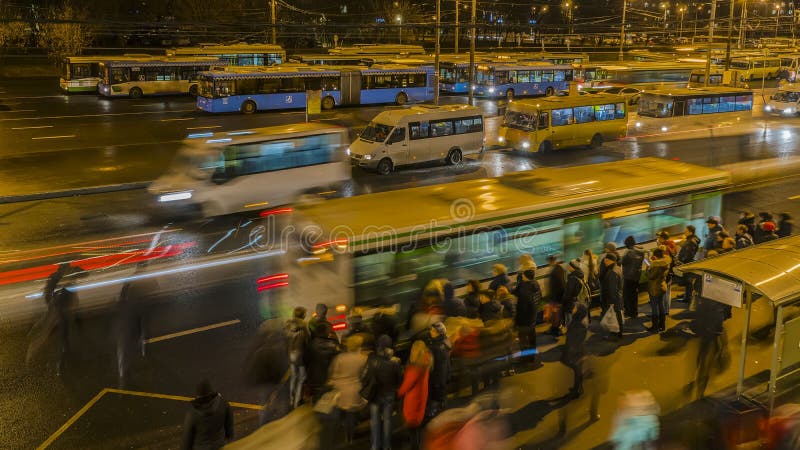 Passengers Waiting and Boarding Buses at the Bus Terminal Editorial ...