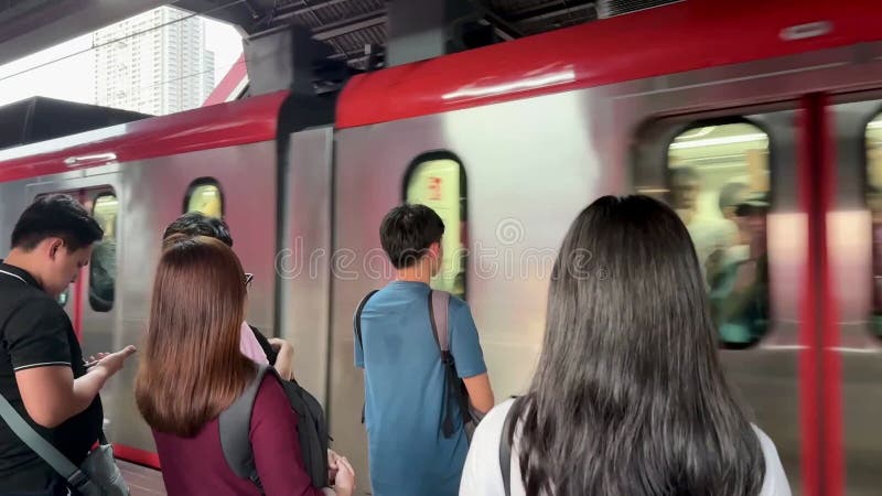 Passengers Waiting for the LRT Train Stock Video - Video of ...