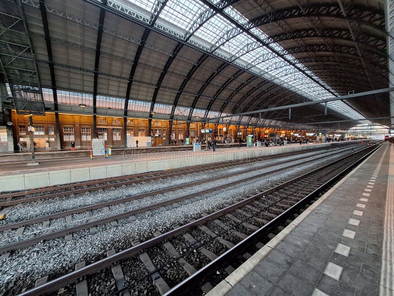 Passengers are Waiting on the Platforms at Amsterdam Central Station ...