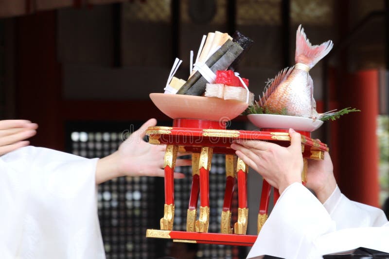 Passing of an Altar Offering Tray with Fish at a Shinto Shrine in Japan ...